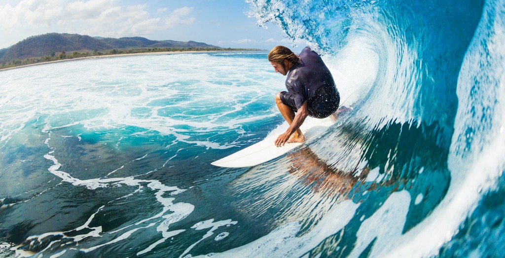 Surfer-on-Blue-Ocean-Wave | Peninsula Financial Group